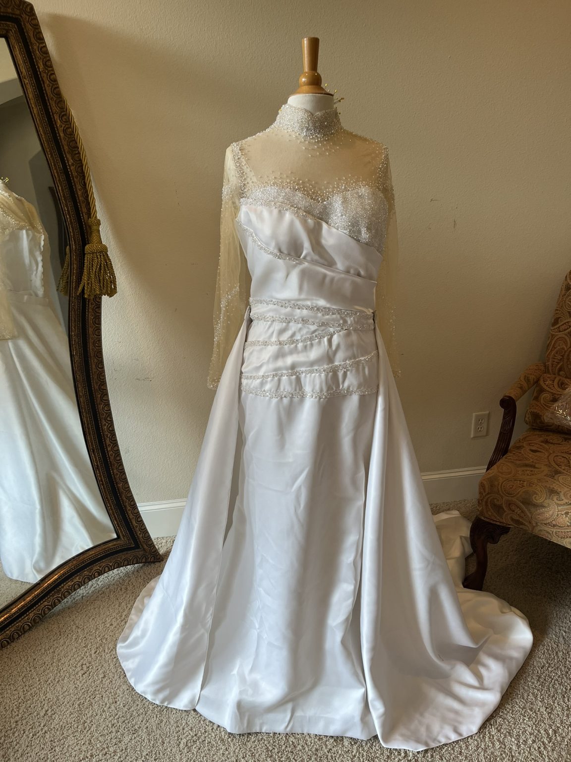 Sheer illusion neckline pleated bodice wedding gown