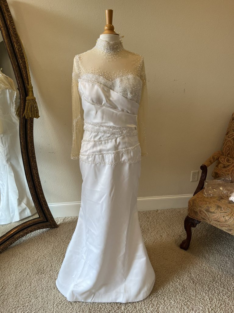 Sheer illusion neckline pleated bodice wedding gown